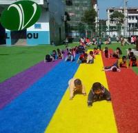 China Eco Friendly Red Coloured Artificial Grass Playground Children Playing for sale