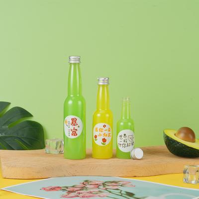 China Mini Juice Bottles Unique Shaped Juice Shot Bottles With Clear Handle for sale