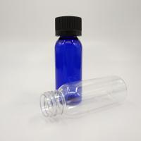 China 1 oz Cobalt Blue Plastic Boston Round Bottles With Black Ribbed Cap for sale