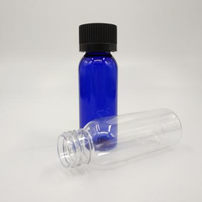 China 1 oz Cobalt Blue Plastic Boston Round Bottles With Black Ribbed Cap for sale