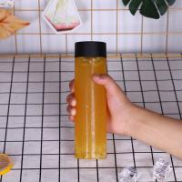 China Modern Milk Tea Bottles Plastic Screw on Lid Durable Leak Proof Design Ideal for Beverage Packaging and Storage Solutions for sale