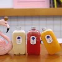 China Handle Milk Tea Bottles Featuring Insulation and Screw on Lid Durable Containers Suitable for Beverage Packaging for sale