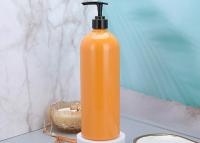 China 25mm Orange Shampoo Plastic Pump Dispenser Bottles 900ml for sale