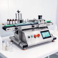 China Automatic Desktop 100ml 300ml 500ml 800ml Water Bottle Labeling Machine for Glass and Plastic Bottle Label Applicator for sale