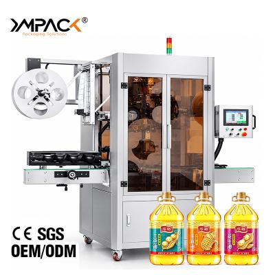 China High Accuracy ±0.5mm Full Automatic Sleeving Label Machine Buckets Cans Bottles Shrink Sleeve Applicator for Beverages and Oil for sale
