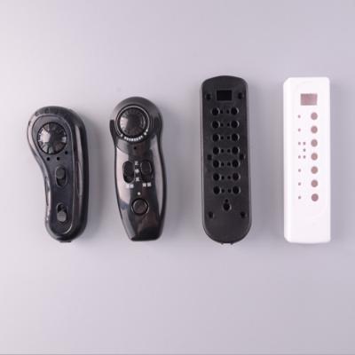 China Customized ABS Plastic Injection Molded Controller Shell 14.6x4.5x1.6mm for Small Home Appliances for sale