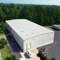 China Prefabricated Steel Structure Warehouse Earthquake Resistant Commercial Metal Building 30m Span for sale
