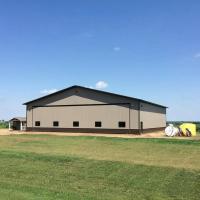 China Prefabricated Steel Structure Warehouse 12-40m Span 50-200mm Sandwich Panel Earthquake Resistant 7-9 Grade for sale