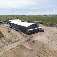 China Custom Prefabricated Steel Structure Warehouse 12-40m Span Sandwich Panels 50 Year Lifespan for sale
