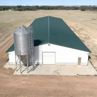 China Customizable Multi-Bay Steel Structure Cow Barn for Commercial Ranch Thermal Insulation Hot-Dip Galvanized for sale