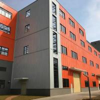 China Windproof Seismic Multi-storey Steel Structure Building Q355 Steel 8-30m Span Prefab Office Tower for sale