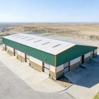 China Large Span Heavy Duty Steel Frame Warehouse 8-40m Custom Size Fireproof Anti-Corrosion for sale