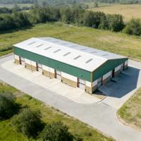 China Large Span Heavy Duty Steel Frame Warehouse 8-40m Custom Size Fireproof Anti-Corrosion for sale