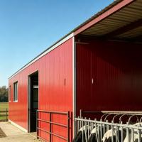 China Hot-dip Galvanized Steel Cow Barn 6-25m Span Wind Load 0.55 kN/m² Adjustable Roll-up Walls for sale