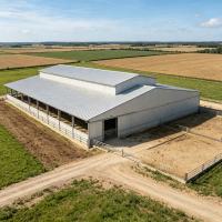 China Prefab Steel Structure Cow House Column-Free Ranch Cattle Barn 6-25m Span for sale