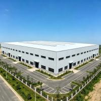 China Custom Steel Structure Warehouse 30m Span Fireproof Anti-Corrosion Prefab Logistics Center 500kg Load for sale