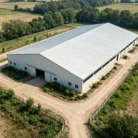 China Modern Steel Frame Cow Shed with Automatic Ventilation Fan Support for Industrial Manufacturing Warehouse Shed Room for sale