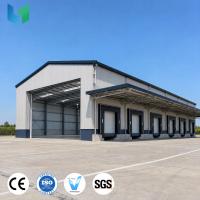 China Prefabricated Steel Warehouse Clear Span Truss Frame with Heavy Duty Concrete Floor and Loading Dock Canopy for Logistics for sale