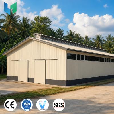 China Prefabricated Steel Cowshed Building with Ridge Ventilation Skylight and Sliding Doors for Tropical Cattle Farm for sale