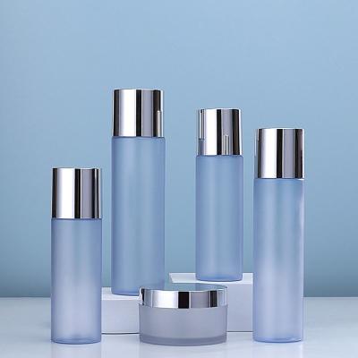 China Clear frosted PET bottle and jar featuring shiny silver plastic lid suitable for eco friendly and reusable cosmetic packaging solutions for sale