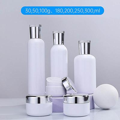 China Round Shouder Cosmetic Bottles And Round Lid Jars For Dispensing Creams Lotions And Serums for sale