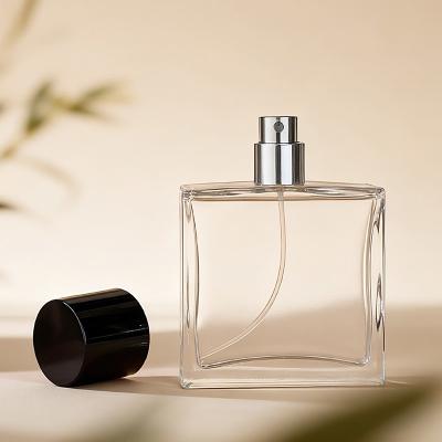 China Flat Shape Spraying Glass Perfume Bottles elegant design exquisite craftsmanship perfect for luxury fragrance packaging and display 50ml 100ml for sale