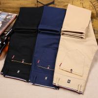 China Men's Four Seasons Stretch Casual Pants with Slim Straight Design and Light Wash for sale