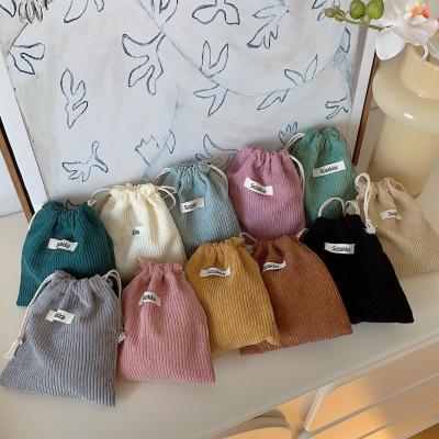 China Customized Color Woven Label Storage Drawstring Fabric Packaging Bag for All Seasons for sale