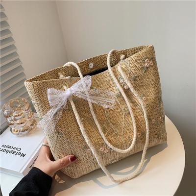 China Beach Grass Woven Single Shoulder Tote Bag with Beautiful Bow in Customized Color for sale