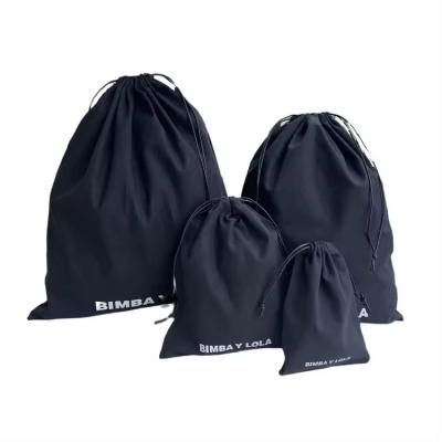 China Medium Black Muslin Calico Canvas Cotton Drawstring Pouch Bags with Customized Logo for sale