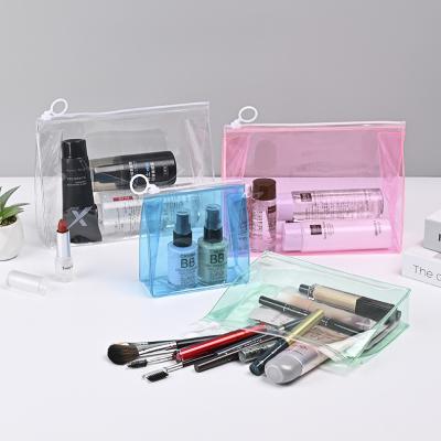 China Low MOQ PVC Custom LOGO Pouch Travel Clear Zip Lock Cosmetic Bag with Customized Logo for sale