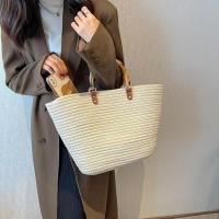 China Stylish Women Woven Beach Straw Handbag Casual Handmade Hollow Out Rattan Shoulder Bags for sale