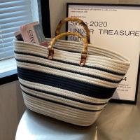 China Stylish Women Woven Beach Straw Handbag Casual Handmade Hollow Out Rattan Shoulder Bags for sale