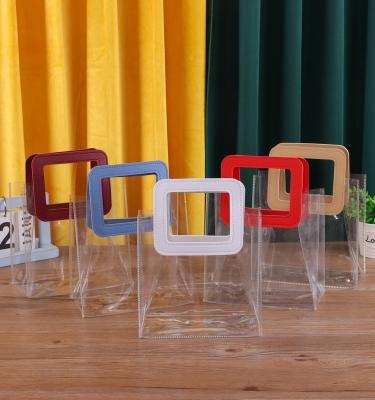 China Customized Logo Accepted PVC Clear Plastic Tote Bag with Die Cut Handle for sale