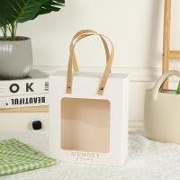 China Custom Printed Kraft Handle Paper Bag for Retail Packaging Clothing Shoes Fur Gifts for sale