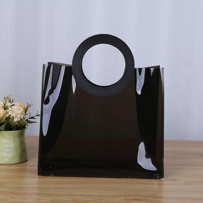 China Clear Transparent Holographic Pvc Gift Iridescent Tote Cosmetic Bag with Laser Handle for sale
