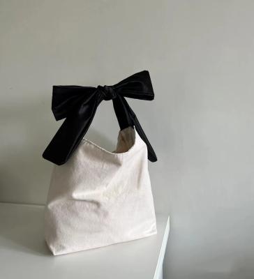 China Customized Color High Capacity Korean Style Bow Hobo Casual Cute Girl Teenage Ladies Shopping Canvas Bag for sale