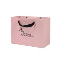 China Custom Luxury Gift Garment Paper Shopping Bags With Logo Print Newest Fashinable for sale