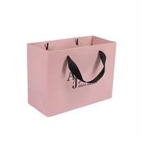 China Custom Luxury Gift Garment Paper Shopping Bags With Logo Print Newest Fashinable for sale