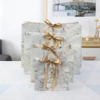 China Customized Color Cardboard Shopping Paper Bags With Ribbon Handle For Clothing Shoes for sale