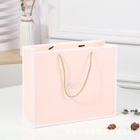 China Custom Printed Shopping Bag Cardboard Luxury White Kraft Paper Gift Bag With Ribbon Handle for sale