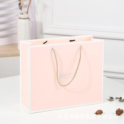China Custom Printed Shopping Bag Cardboard Luxury White Kraft Paper Gift Bag With Ribbon Handle for sale
