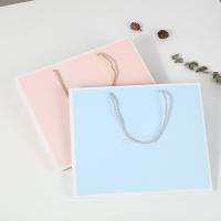 China Custom Printed Shopping Bag Cardboard Luxury White Kraft Paper Gift Bag With Ribbon Handle for sale