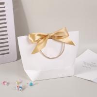 China Gift Paper Bag Packaging With Handle For Custom Clothing Shopping Bags Packing Items for sale