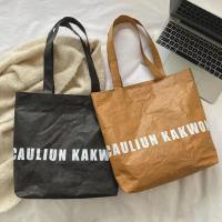 China Unisex Large Kneaded Washable Kraft Paper Hand Bag with Custom Logo and Single Handle for sale
