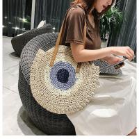 China 2022 Handwoven Round Beach Shoulder Bag Straw Bag with Leather Handle and Custom Logo for sale