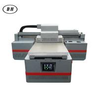 China Best Price UV Flatbed Printer Can Print Both Flatbed Rigid Board, Also Print Rotary Bottle Customized Uv Printer for sale