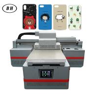 China Best Price UV Flatbed Printer Can Print Both Flatbed Rigid Board, Also Print Rotary Bottle Customized Uv Printer for sale