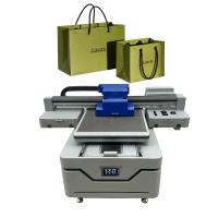 China Multifunction 6090 UV FlatBed Machine Print Phone Case Glass Bottle Pen PVC Acrylic Ceramic Wood Metal for sale