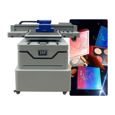 China Factory Price 6090 Price with 3 I3200/XP600 Heads CCD Camera,and Rotary Attachment  UV Flatbed Printing for Multi-Material for sale